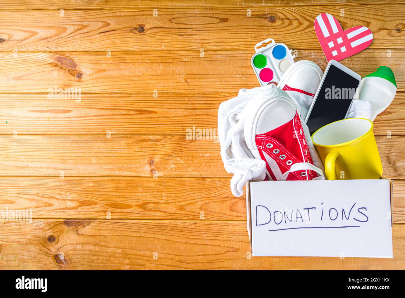 Donation Box with various give goods for Giving Tuesday, with red heart ...