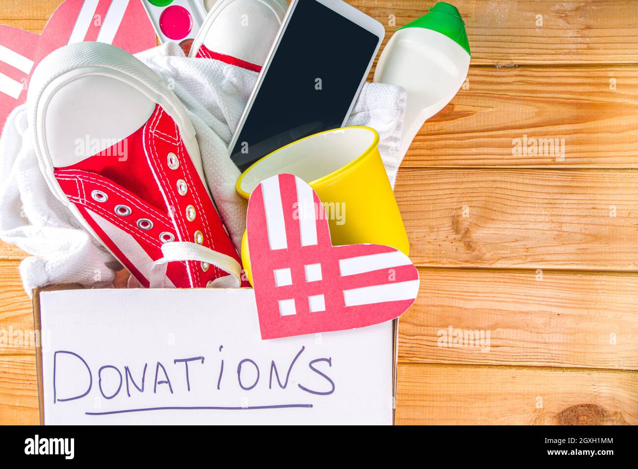 Donation Box with various give goods for Giving Tuesday, with red heart ...