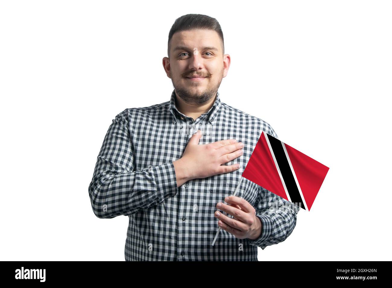 White guy holding a flag of Trinidad and Tobago and holds his hand on ...