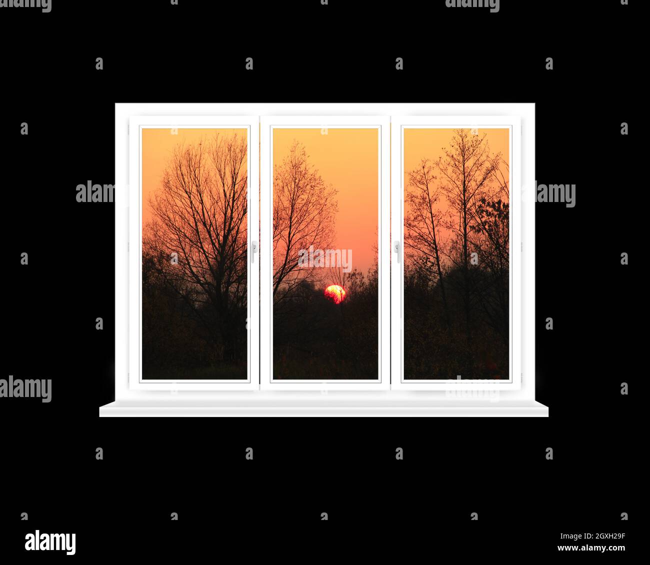 White window with sunset beyond isolated on black background. View from ...