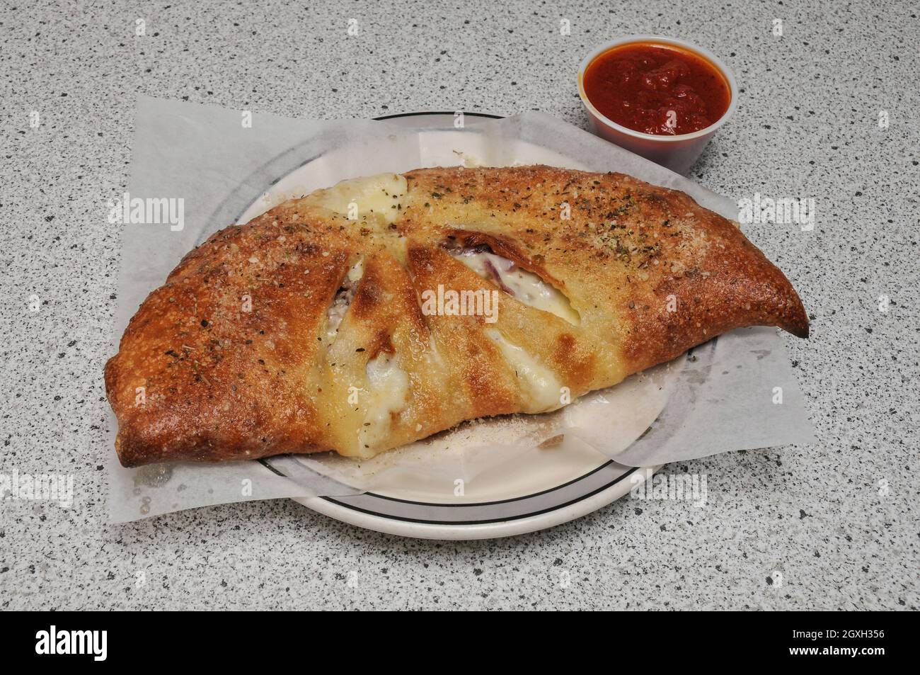 Delicious Italian cuisine known as a calzone Stock Photo - Alamy