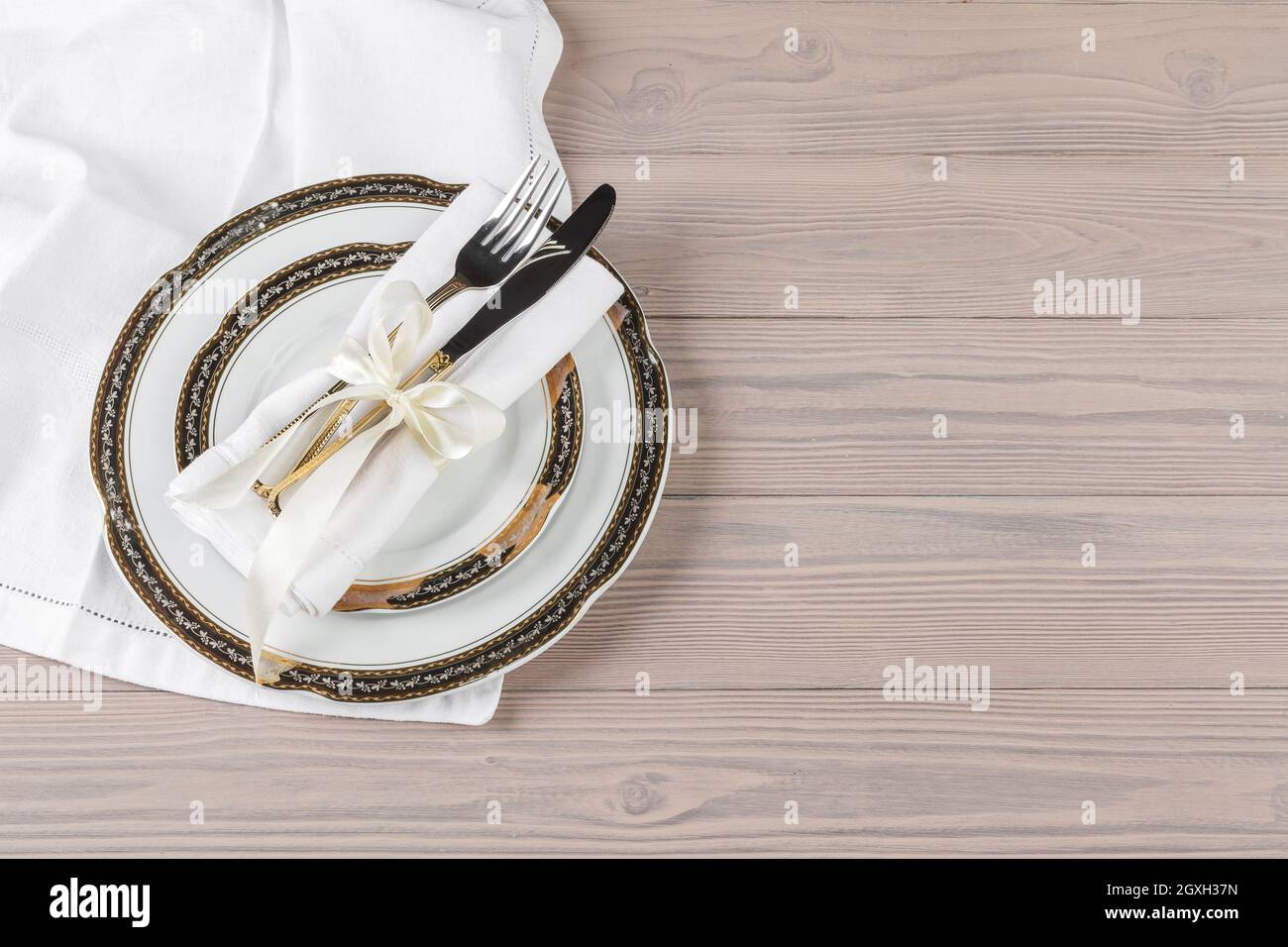 Beautiful table setting on wooden table from above Stock Photo - Alamy
