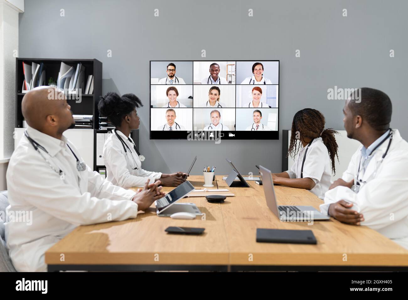 Doctor In Online Medical Video Conference With Diverse Team Of Hospital ...