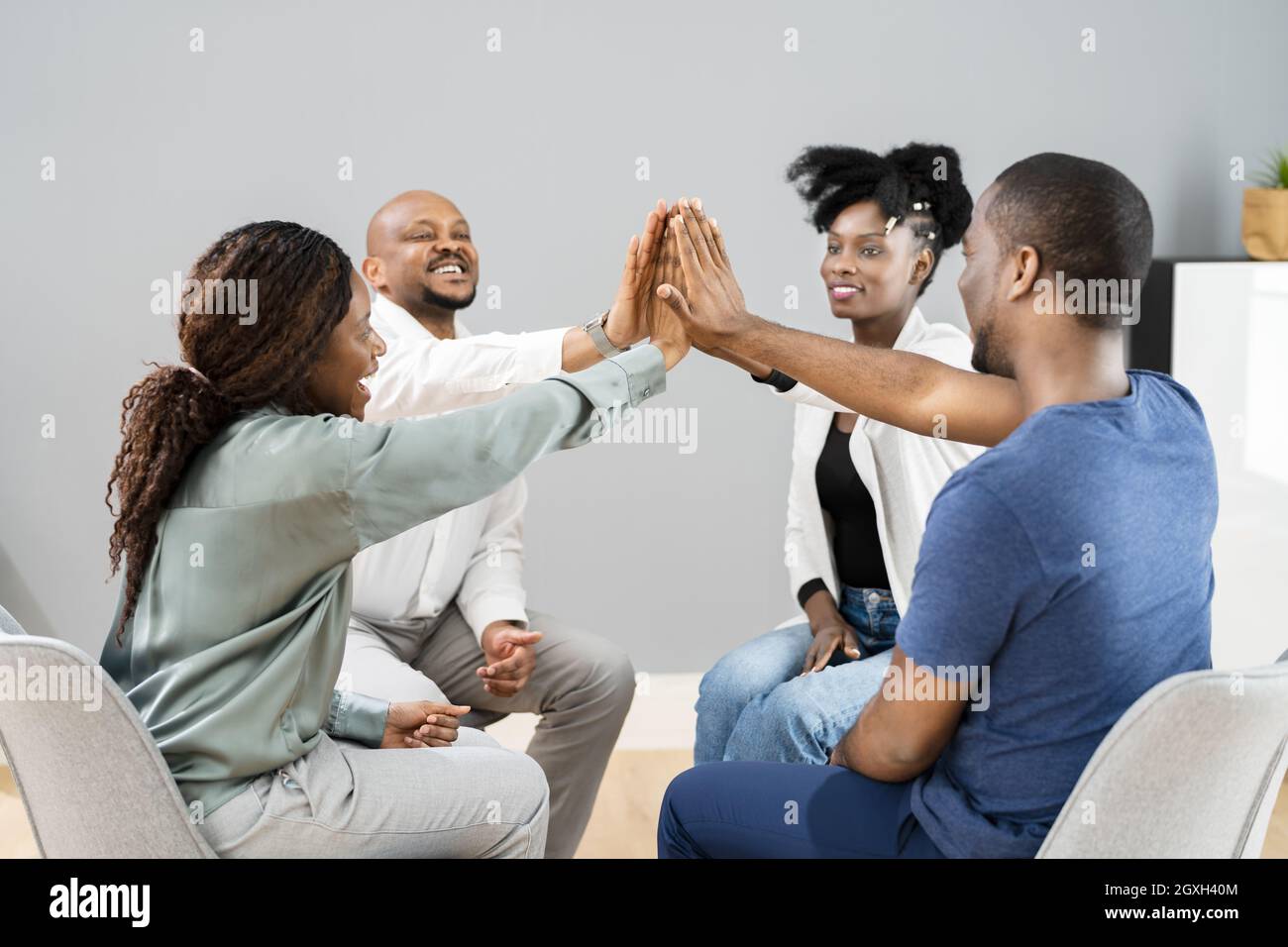 Motivational Business Meeting At Workplace. African Hands Giving High ...