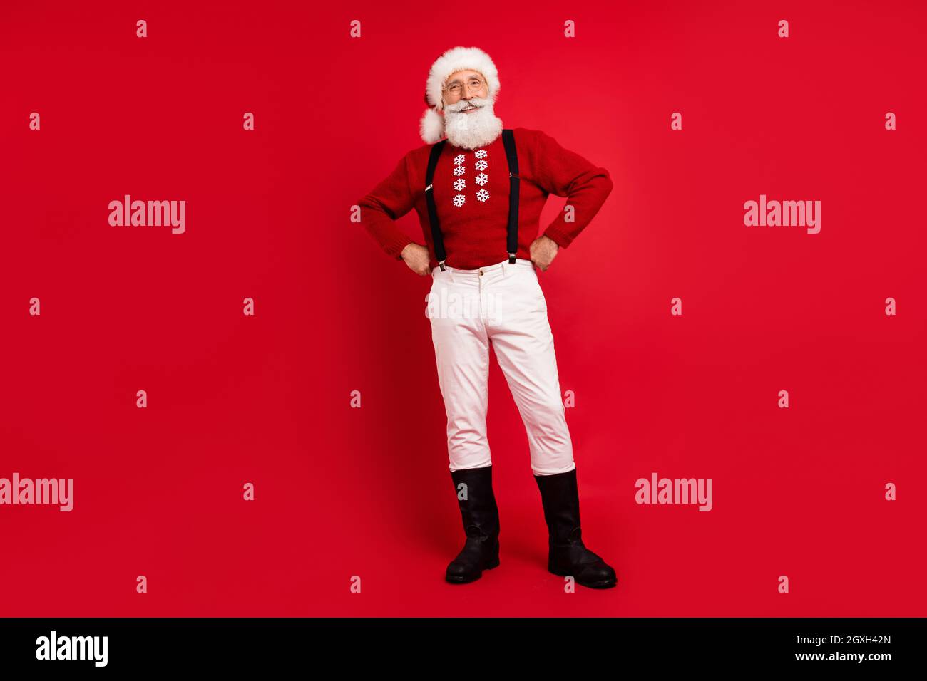 Full length body size view of attractive cheerful Santa hands on hips ...