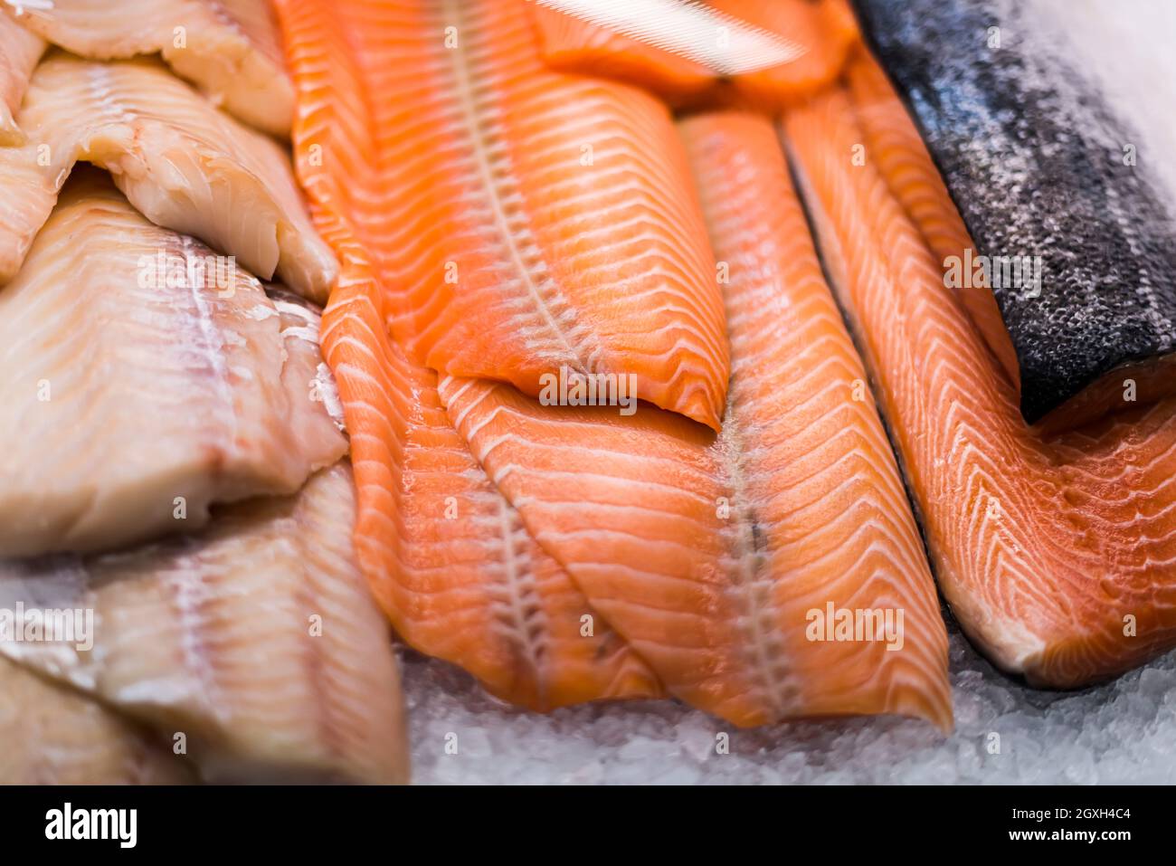 Fresh fish fillet put up for sale in a supermarket refrigerator Stock ...