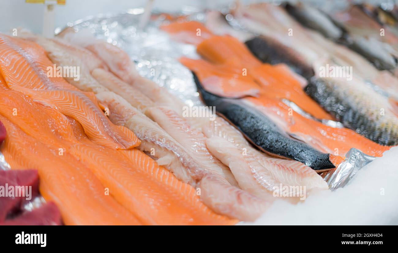 Fresh fish fillet put up for sale in a supermarket refrigerator Stock ...