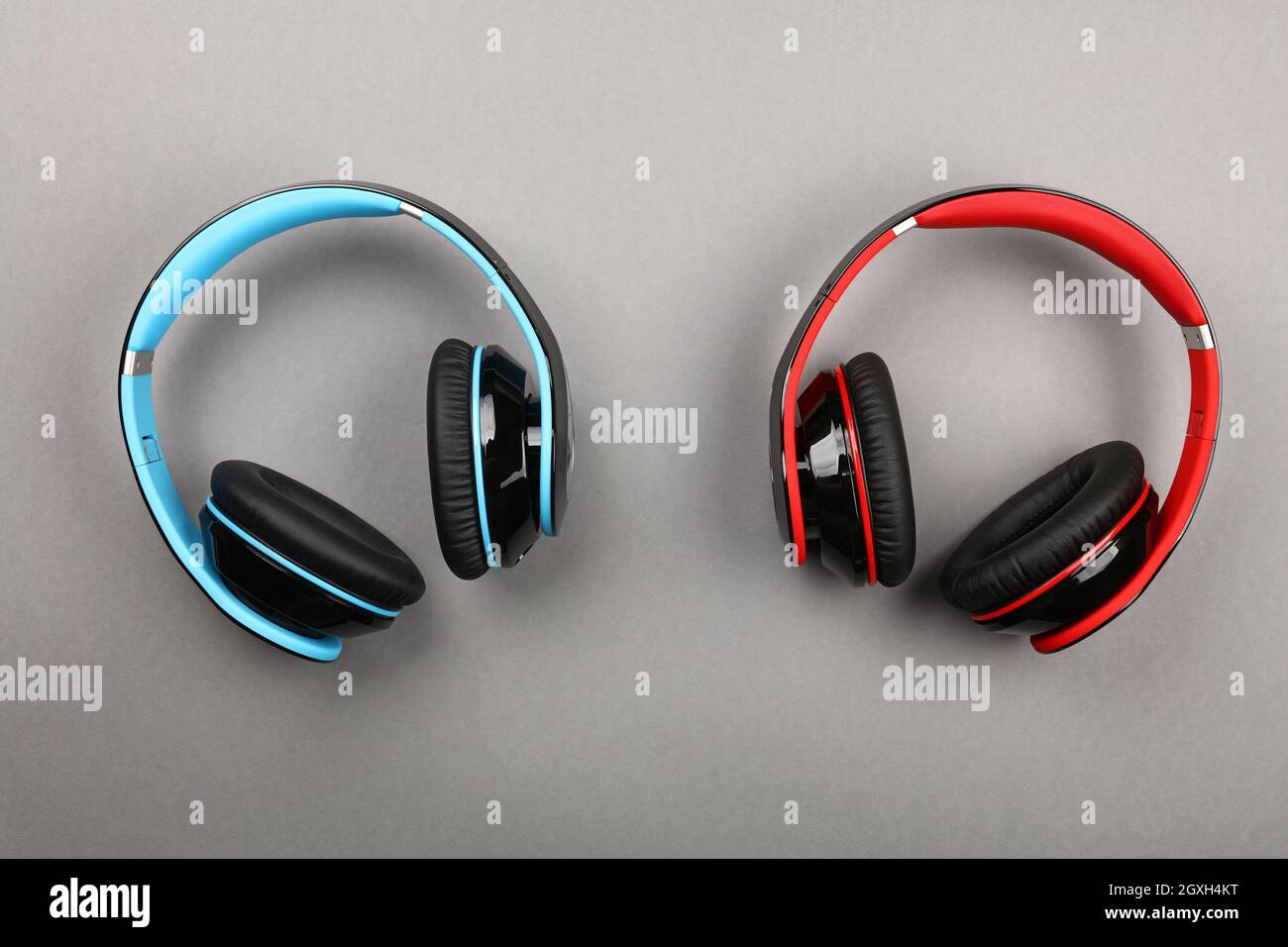 Close up modern wireless plastic red and blue headphones with big ...