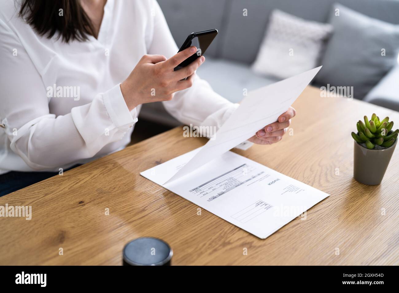 Taking Invoice Document Photo Using Phone Or Smartphone Stock Photo - Alamy
