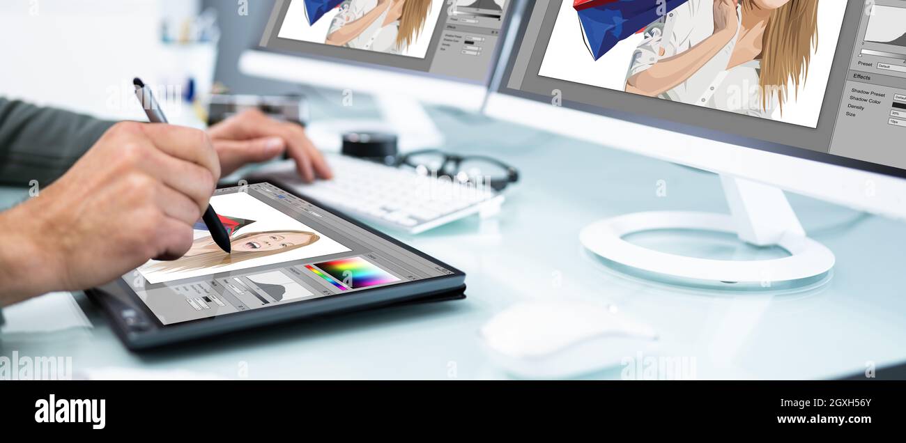 Designer And Photographer Using Multiple Computer Screens Stock Photo ...