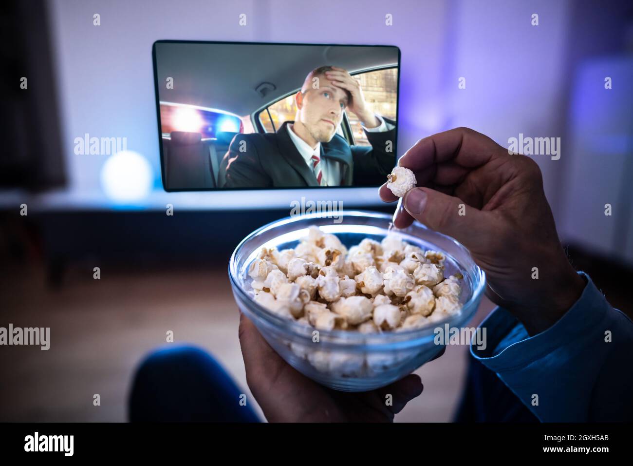 Enjoying Popcorn Snacks Watching TV Or Television On Sofa Stock Photo ...