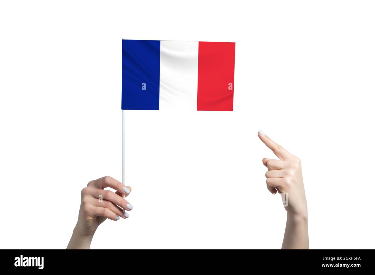 A beautiful female hand holds a France flag to which she shows the ...