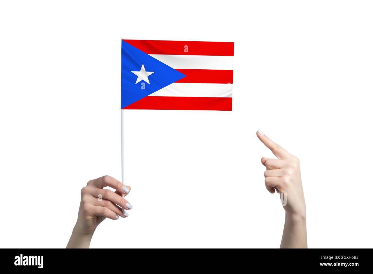 A beautiful female hand holds a Puerto Rico flag to which she shows the ...