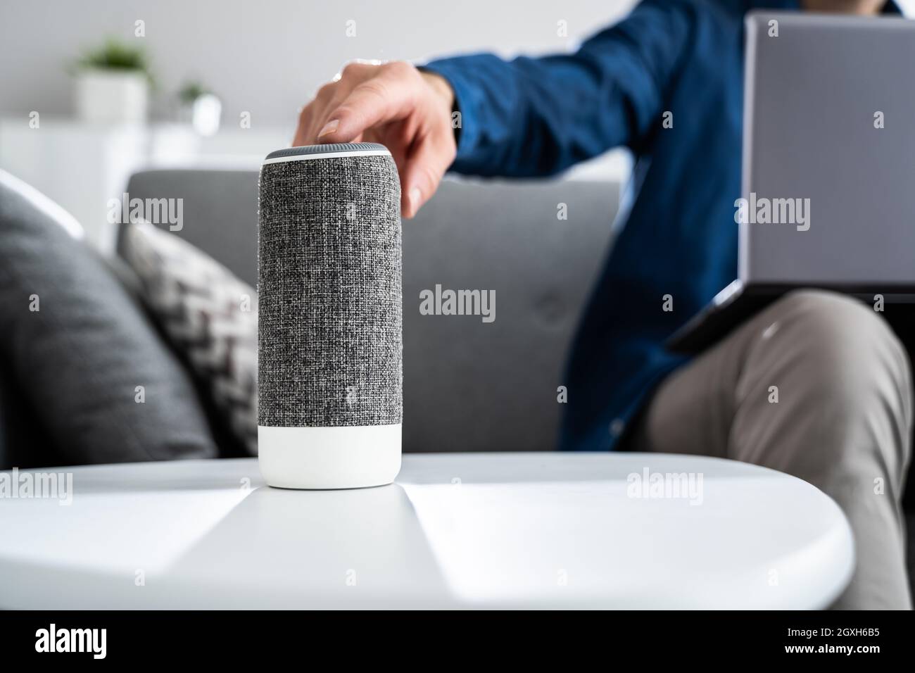 Using Smart Voice Assistant Wireless Mini Speaker Stock Photo - Alamy