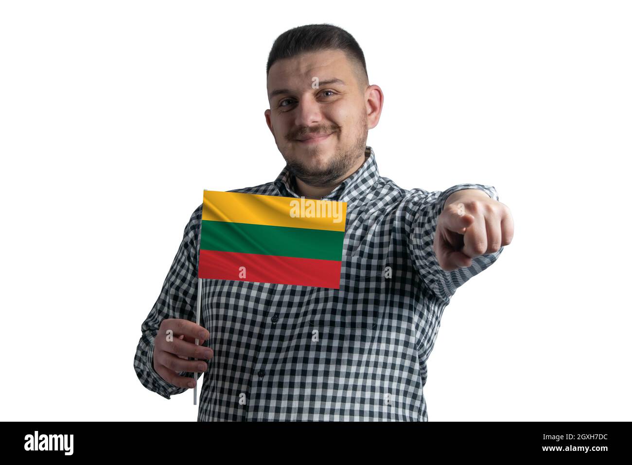 White guy holding a flag of Lithuania and points forward in front of ...