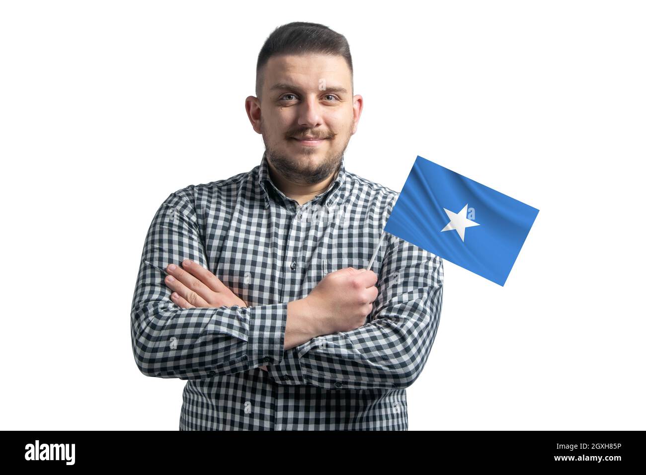 White guy holding a flag of Somalia smiling confident with crossed arms ...