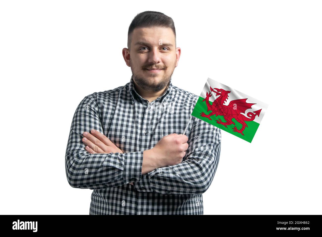 White guy holding a flag of Wales smiling confident with crossed arms ...