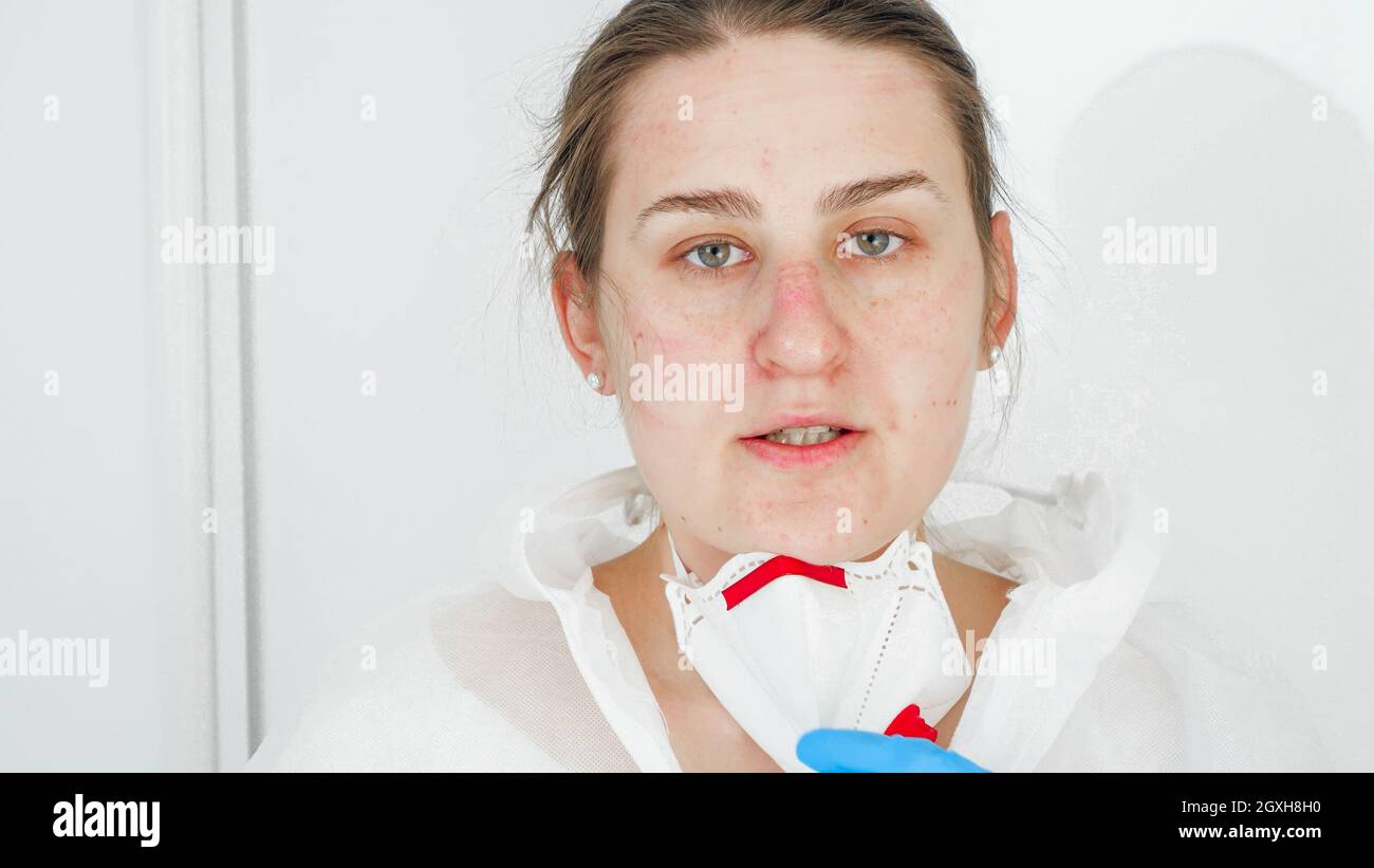Female doctor taking off mask hi-res stock photography and images - Alamy