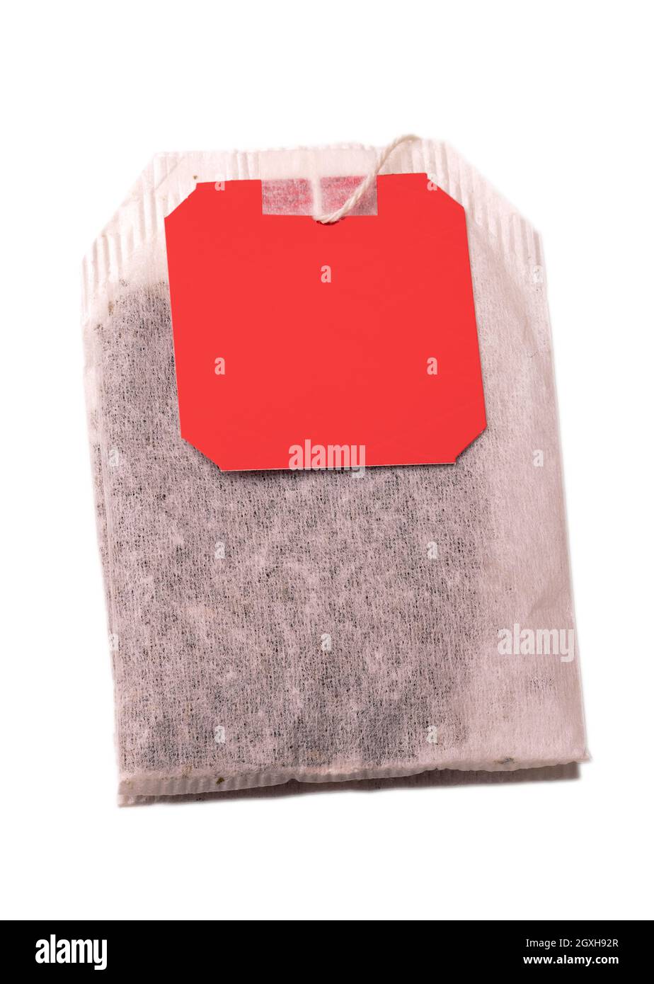 Teabag with red label. Top view. Isolated on a white. with clipping ...