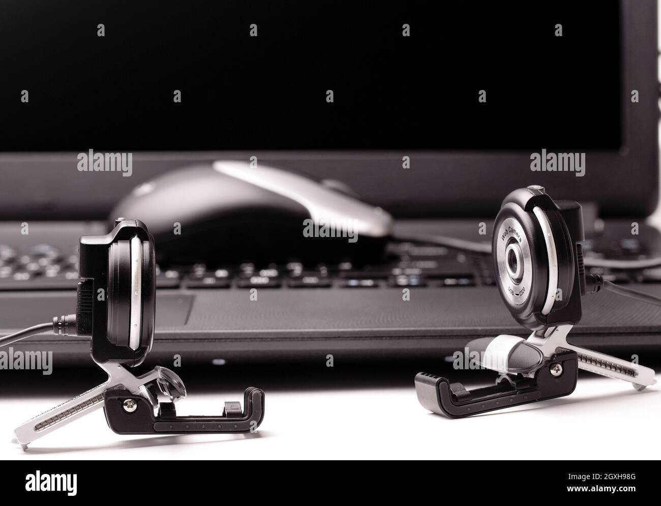 two Web cams on the laptop screen dark flne and mouse Stock Photo - Alamy