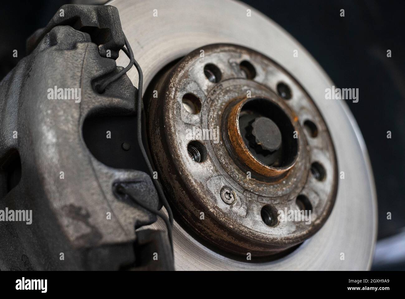 Disc brake detail with blurred background in a workshop Stock Photo - Alamy