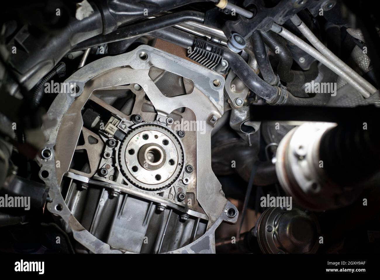 Detail of Car flywheel assembly in a workshop, car reparation engine ...