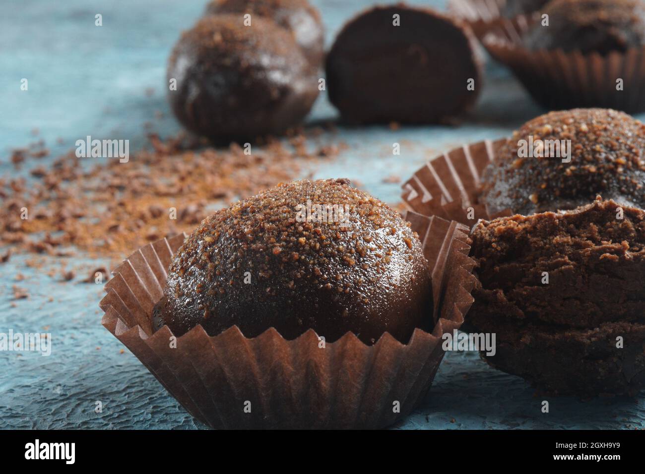 Chocolate petit fours on a table. Chocolate petit four sweets with ...