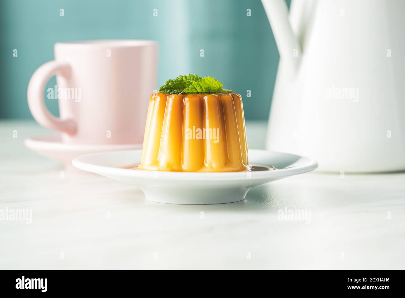 Sweet vanilla pudding. Sweet dessert with caramel topping on white ...