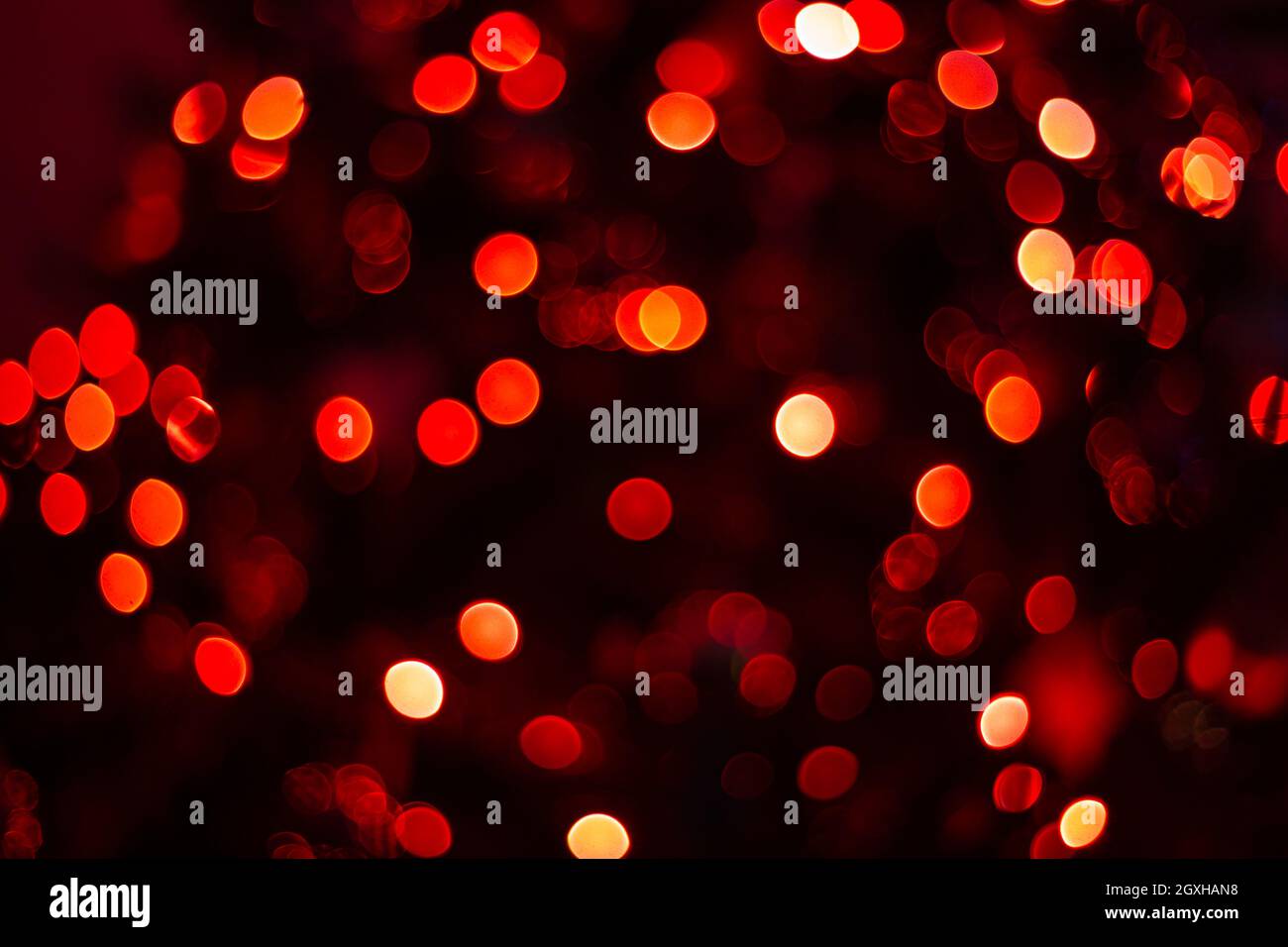 Various blurry red lights on black background Stock Photo - Alamy