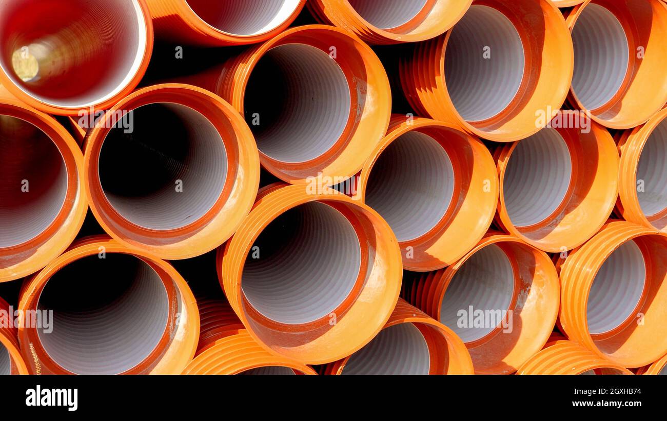 Pvc pipes and tubes stacked in the factory warehouse ready for ...