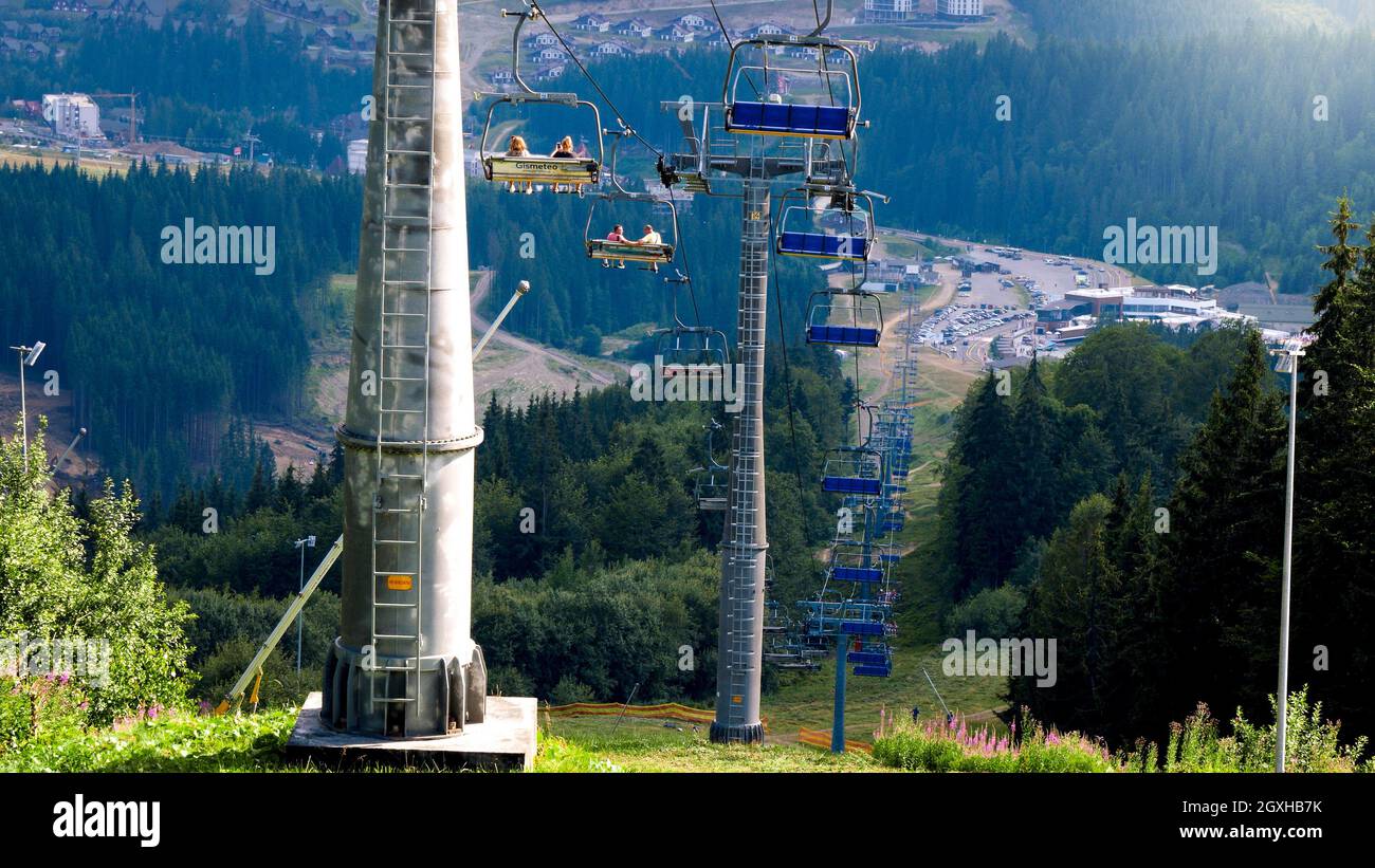 Chairlift ride above forest hi-res stock photography and images - Alamy