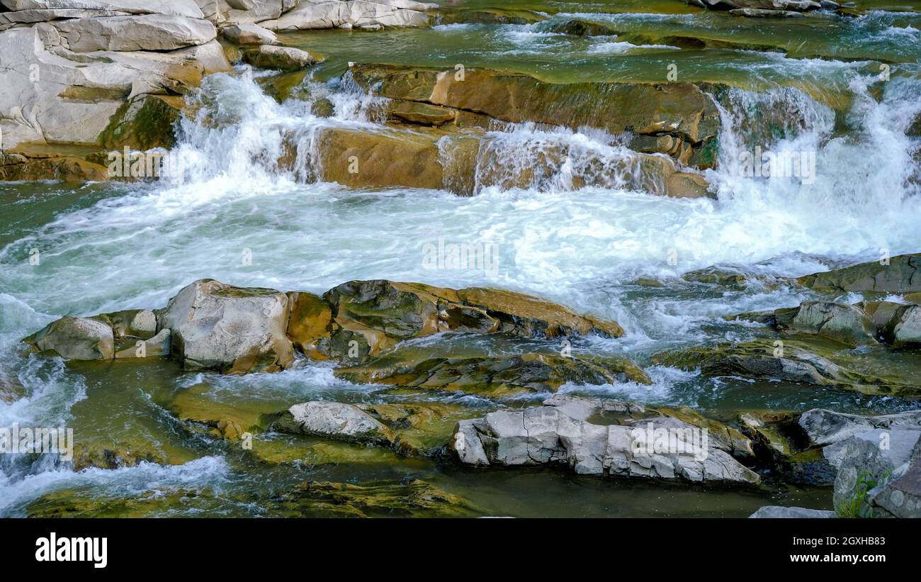 Fast mountain river flowig in cascade of waterfalls Stock Photo - Alamy