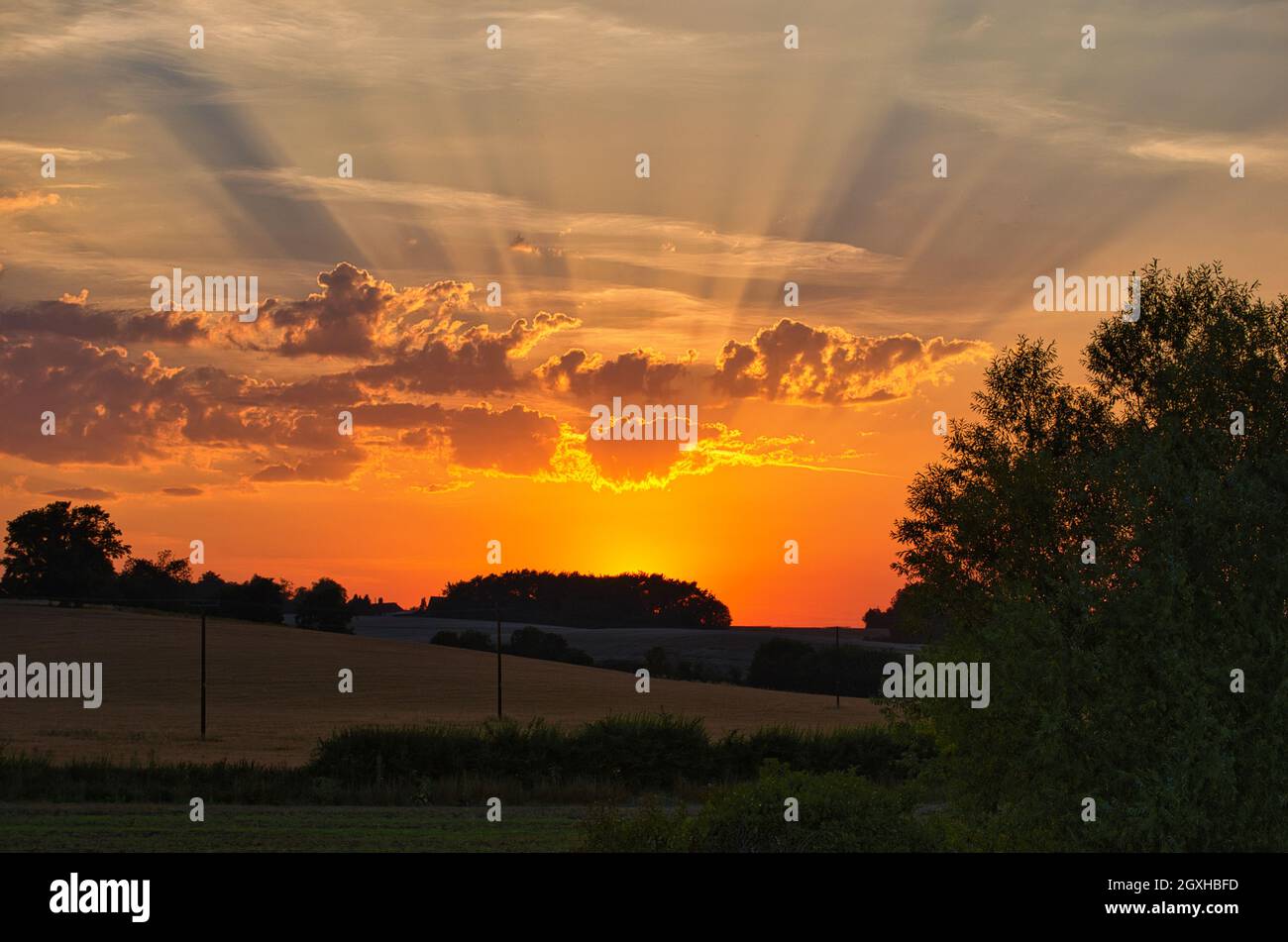 Dramatic Sun Rays Suffolk sunset Stock Photo - Alamy