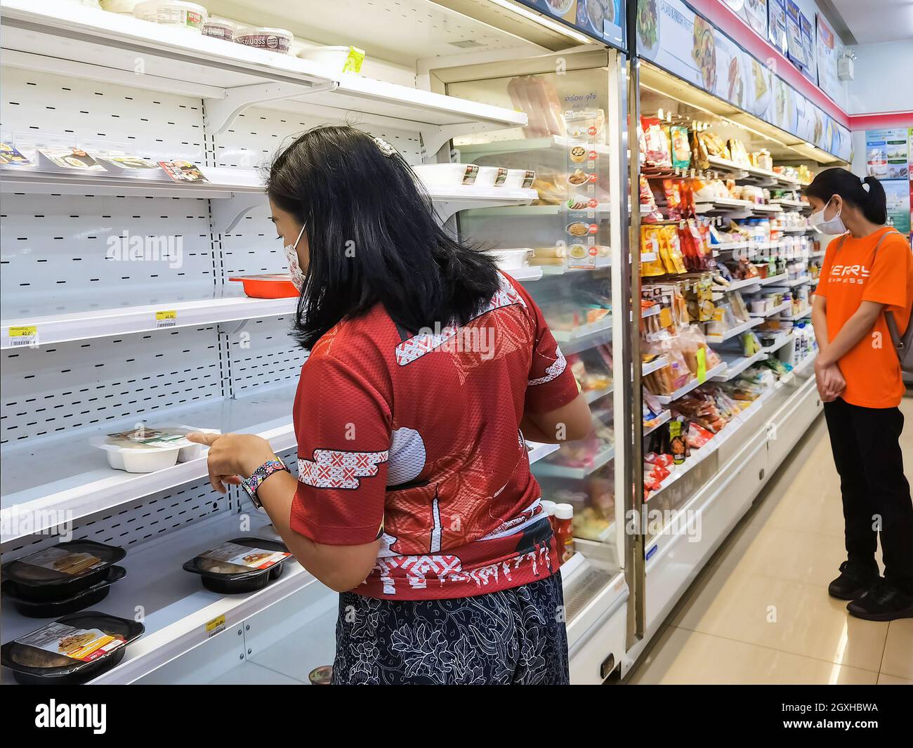 KANCHANABURI,THAILAND-AUGUST 14,2021 : Unidentified woman choose food ...