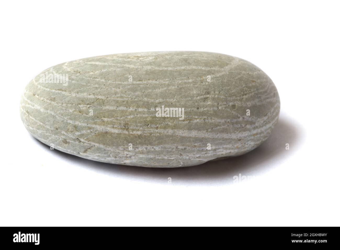 striped stone with shadow isolated on white background. sea pebbles ...