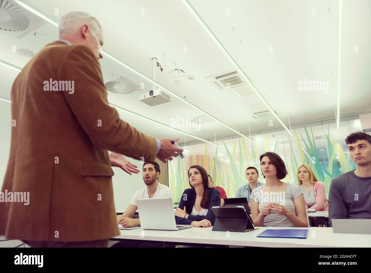 group of students study with professor in modern school classroom Stock ...