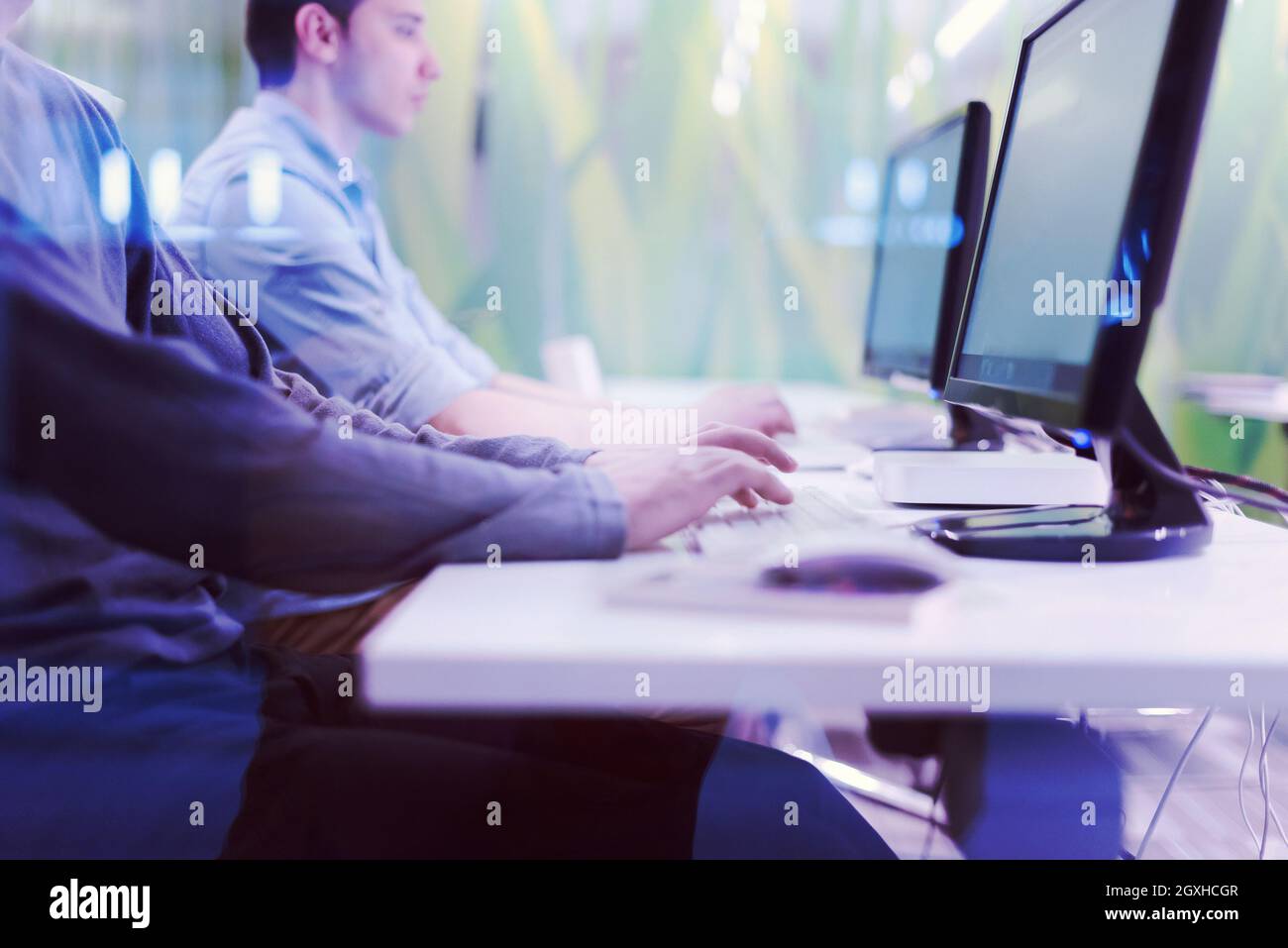 technology students group in computer lab school classroom working on ...