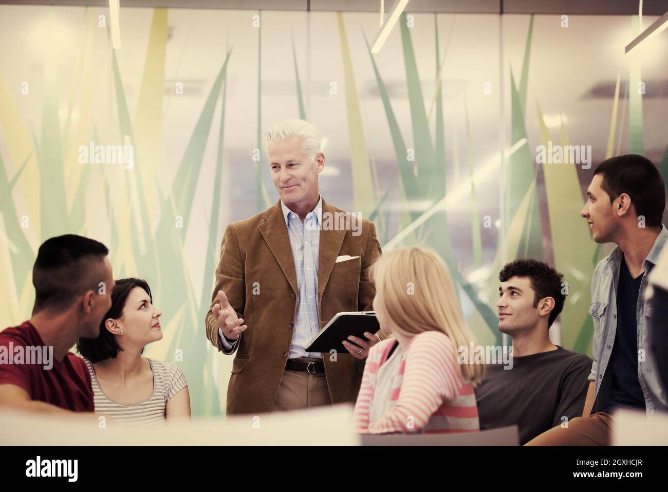 group of students study with professor in modern school classroom Stock ...