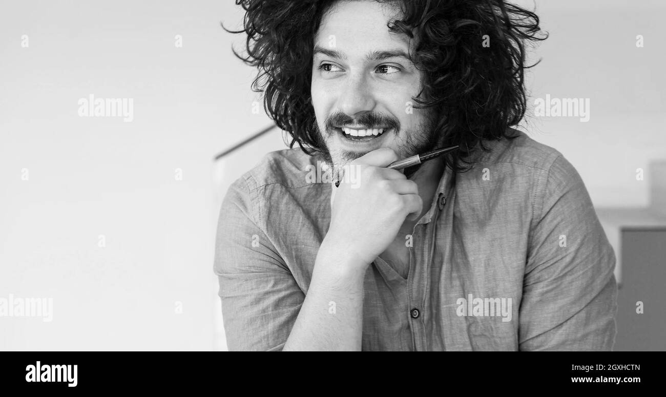 Young man eating home Black and White Stock Photos & Images - Alamy