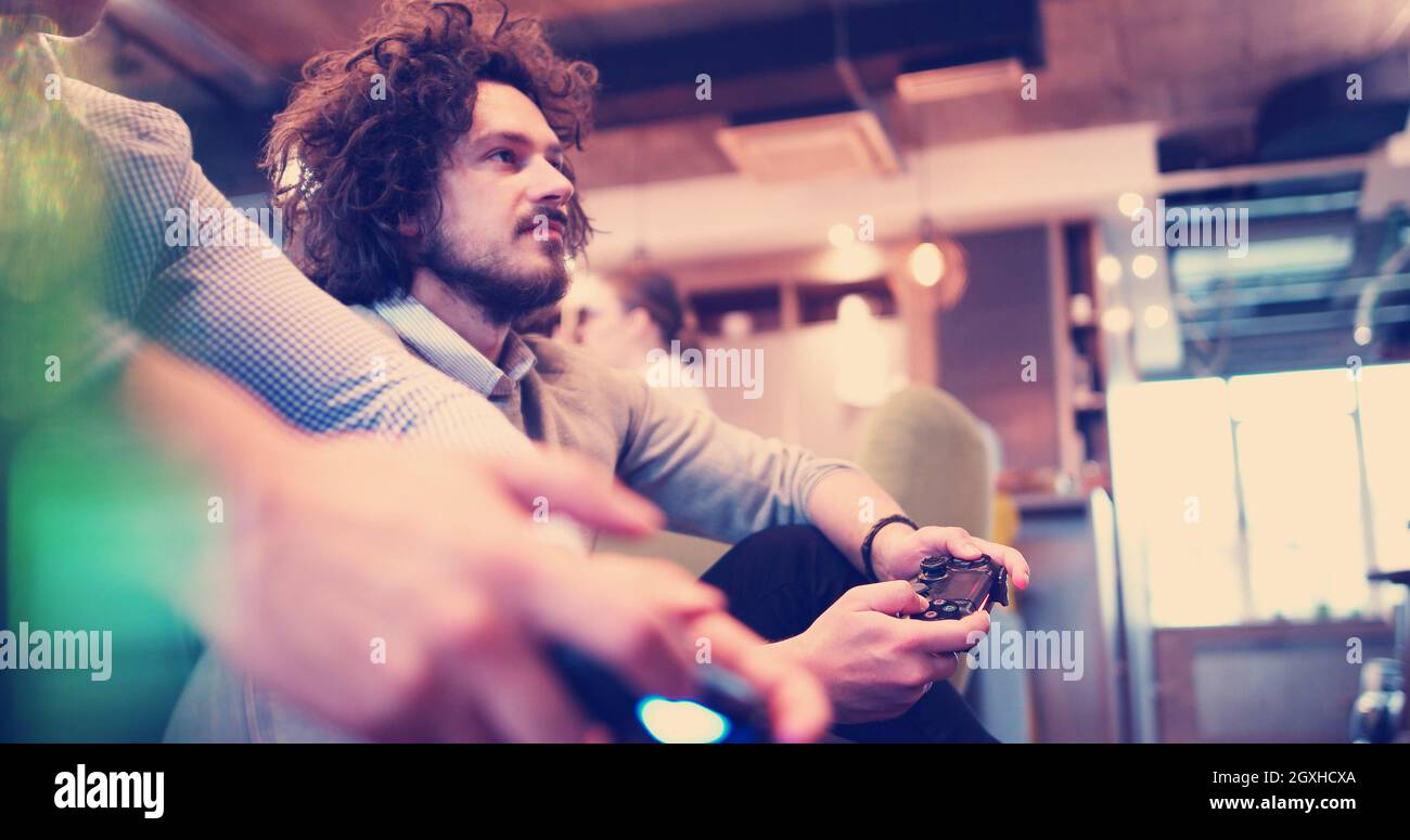 Work hard play hard. Office Workers Playing computer games Stock Photo ...