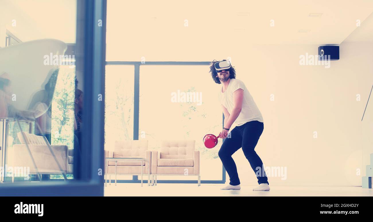 happy man getting experience using VR-headset glasses of virtual ...