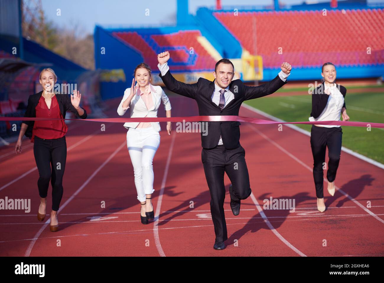 business people running together on athletics racing track Stock Photo ...