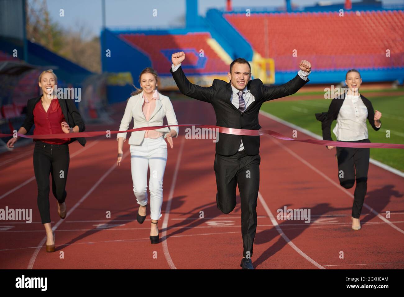 business people running together on racing track Stock Photo - Alamy