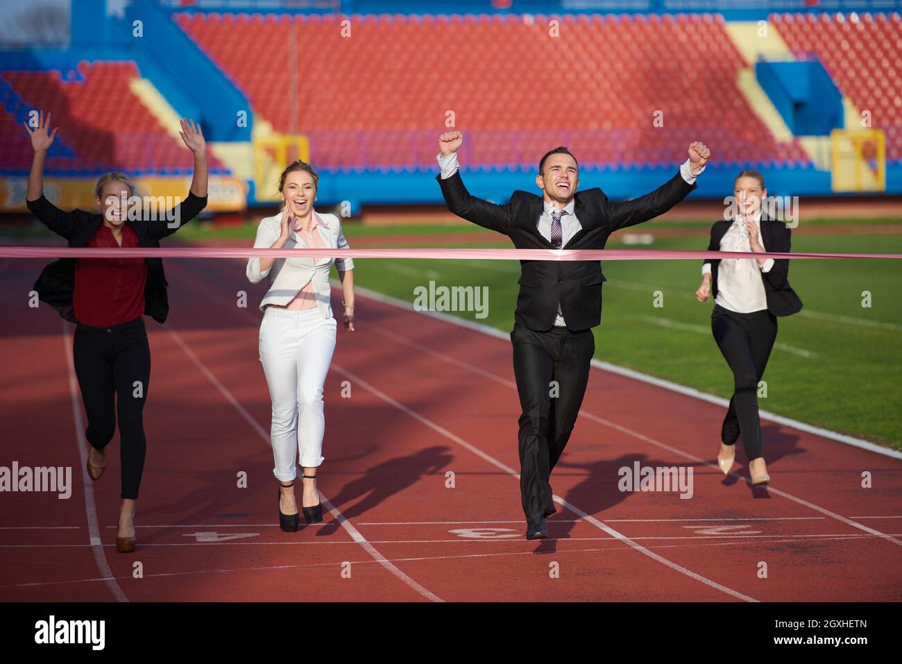 business people running together on racing track Stock Photo - Alamy