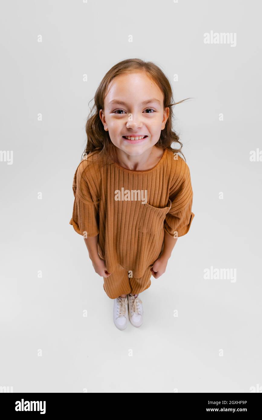 Portrait of little Caucasian girl, child smiling at camera isolated ...
