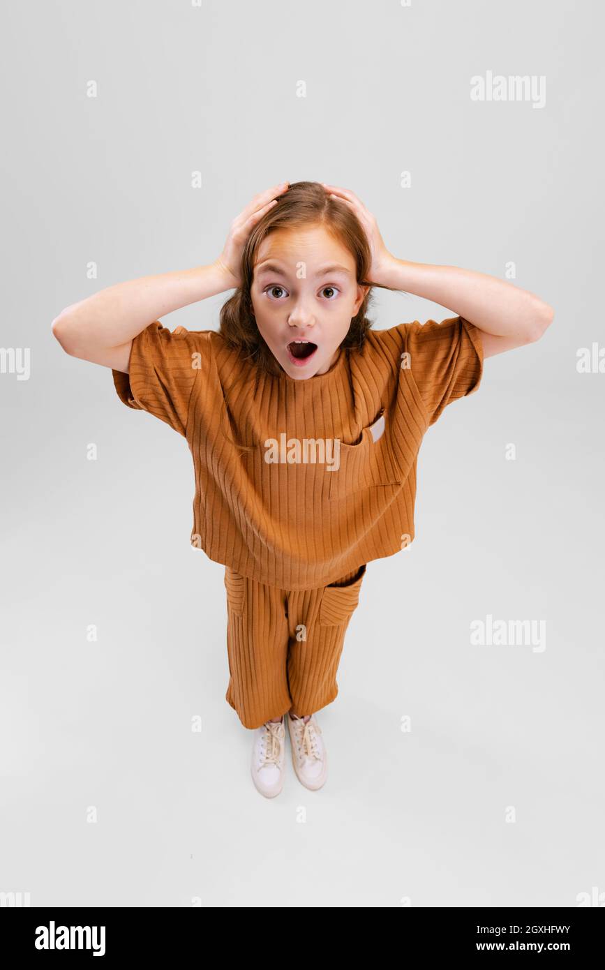 Portrait of little Caucasian girl making funny facial expression,posing ...