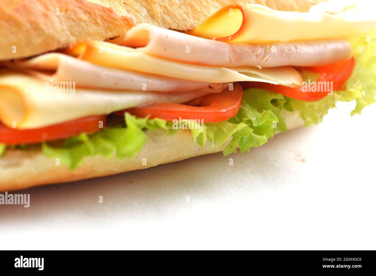 fresh sandwich close up with vegetables and meat fish isolated on white ...
