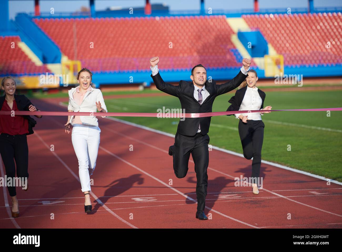 business people running together on athletics racing track Stock Photo ...
