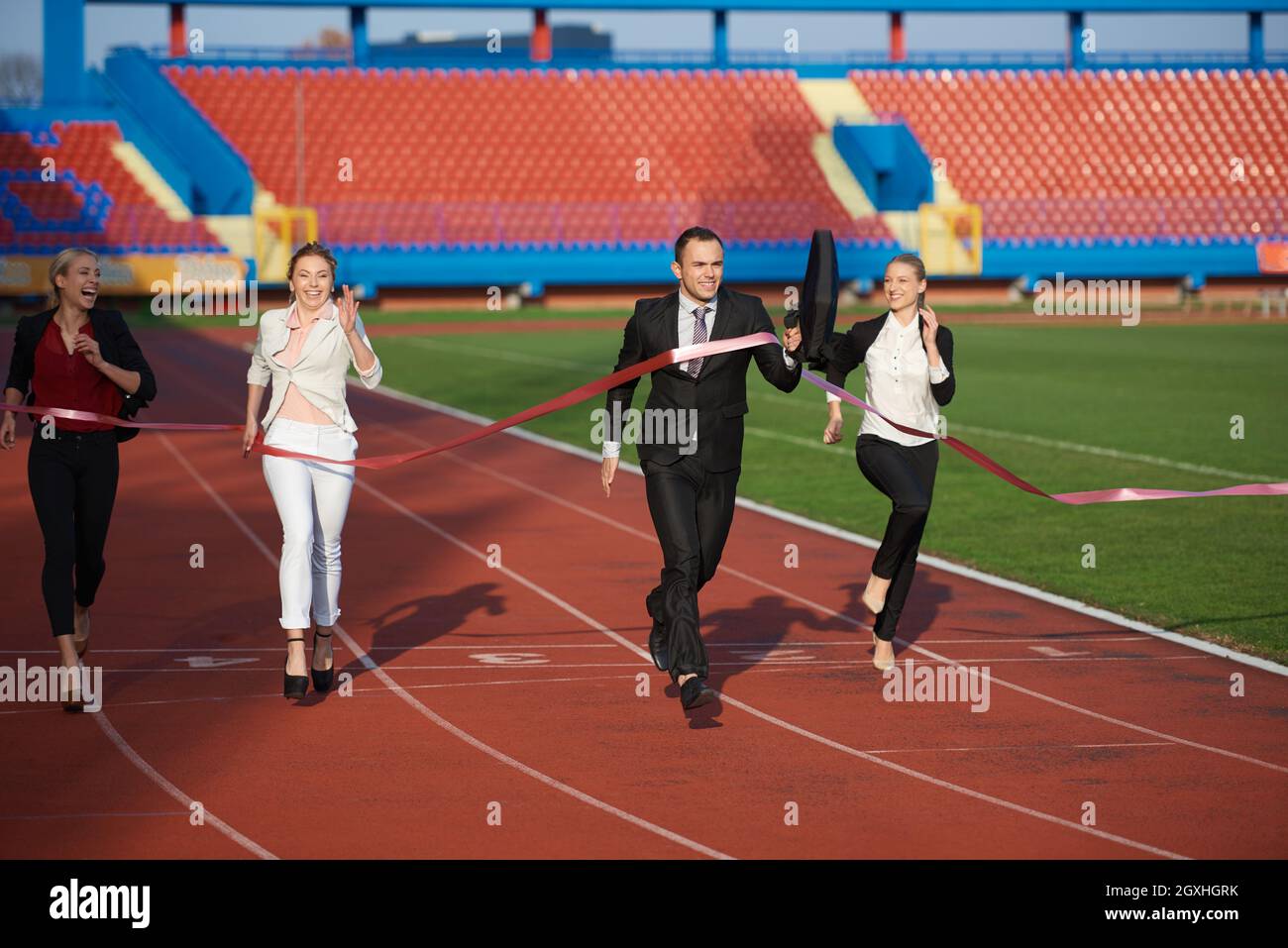 business people running together on racing track Stock Photo - Alamy