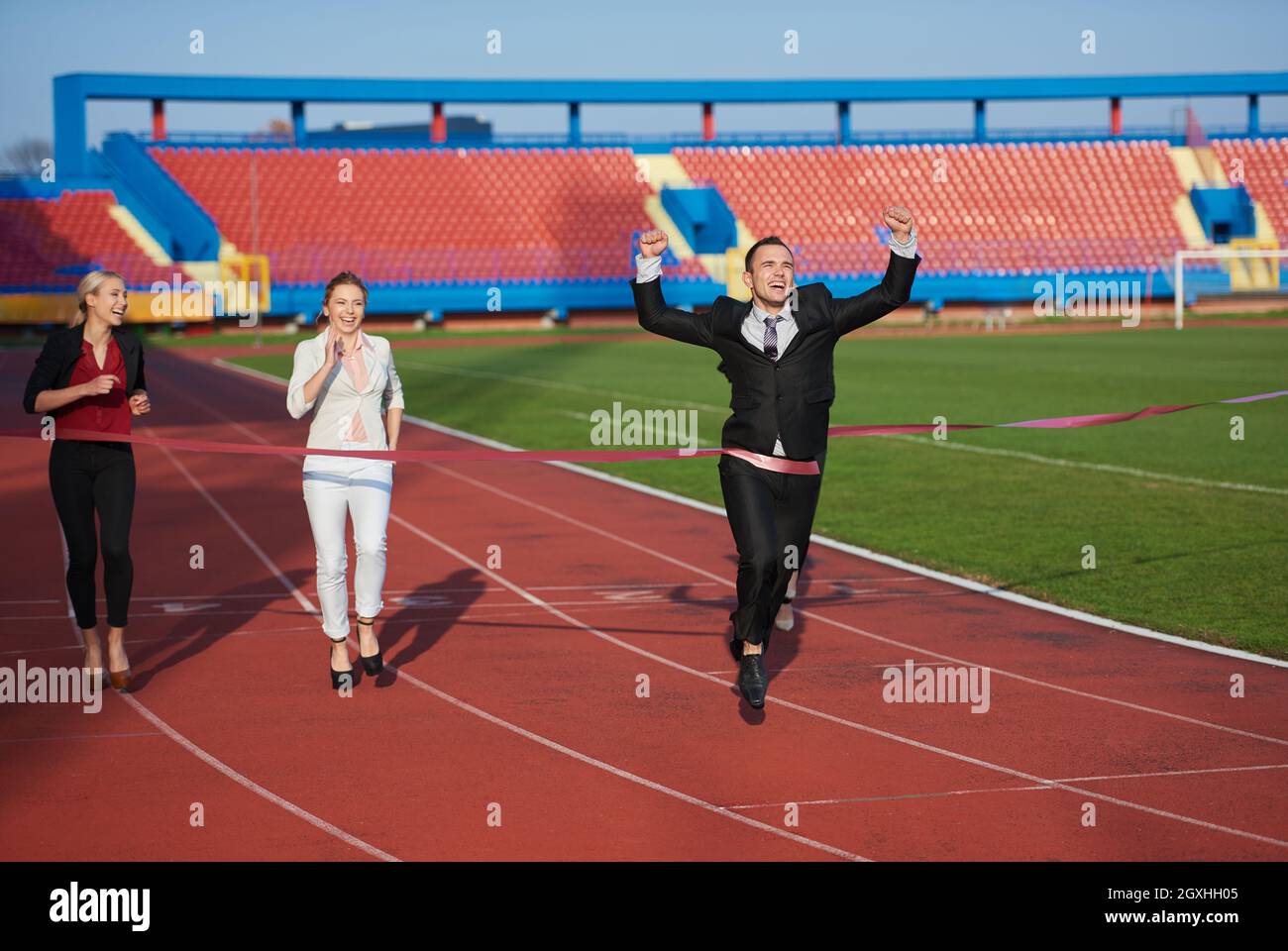 business people running together on racing track Stock Photo - Alamy